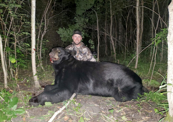 Crookston hunter takes new Minnesota bear record with muzzleloader ...